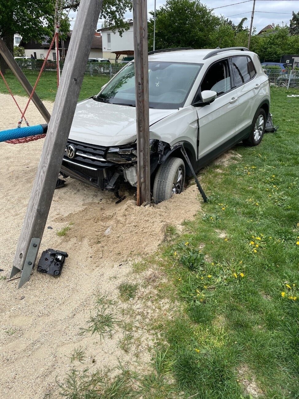 Car in the sand - Accident at an intersection ended at a playground ...
